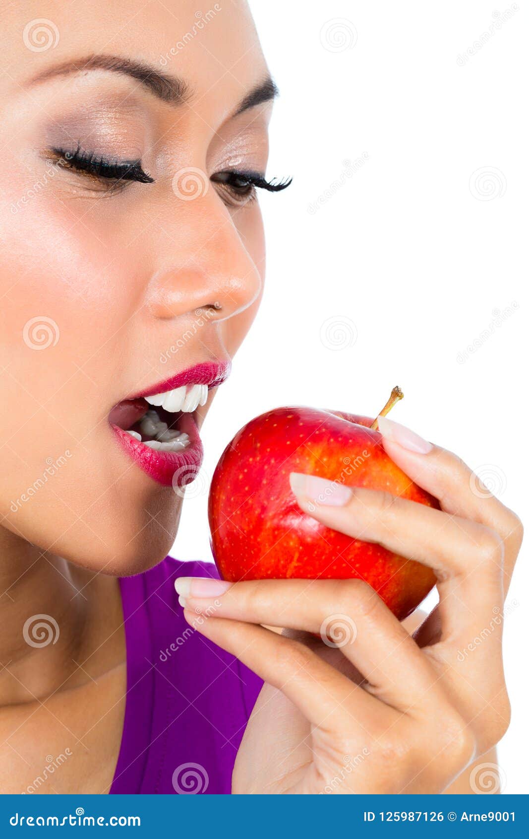 Woman eating apple stock photo. Image of fruit, apple - 125987126