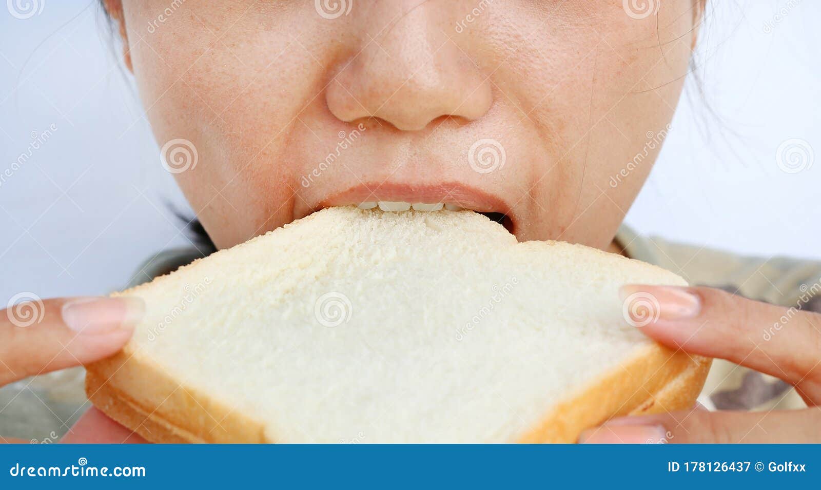 Close Up Young Woman Eating Bread Stock Image - Image of hold, cheerful ...