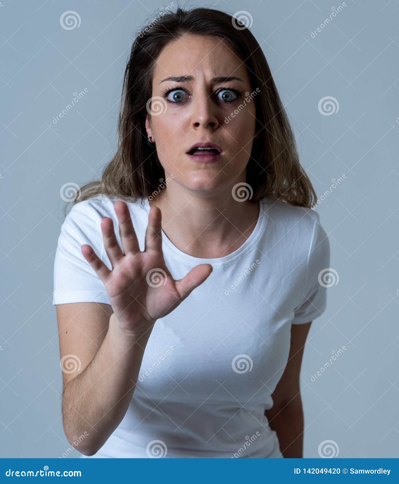 Portrait Of A Young Attractive Woman Looking Scared And Shocked Human