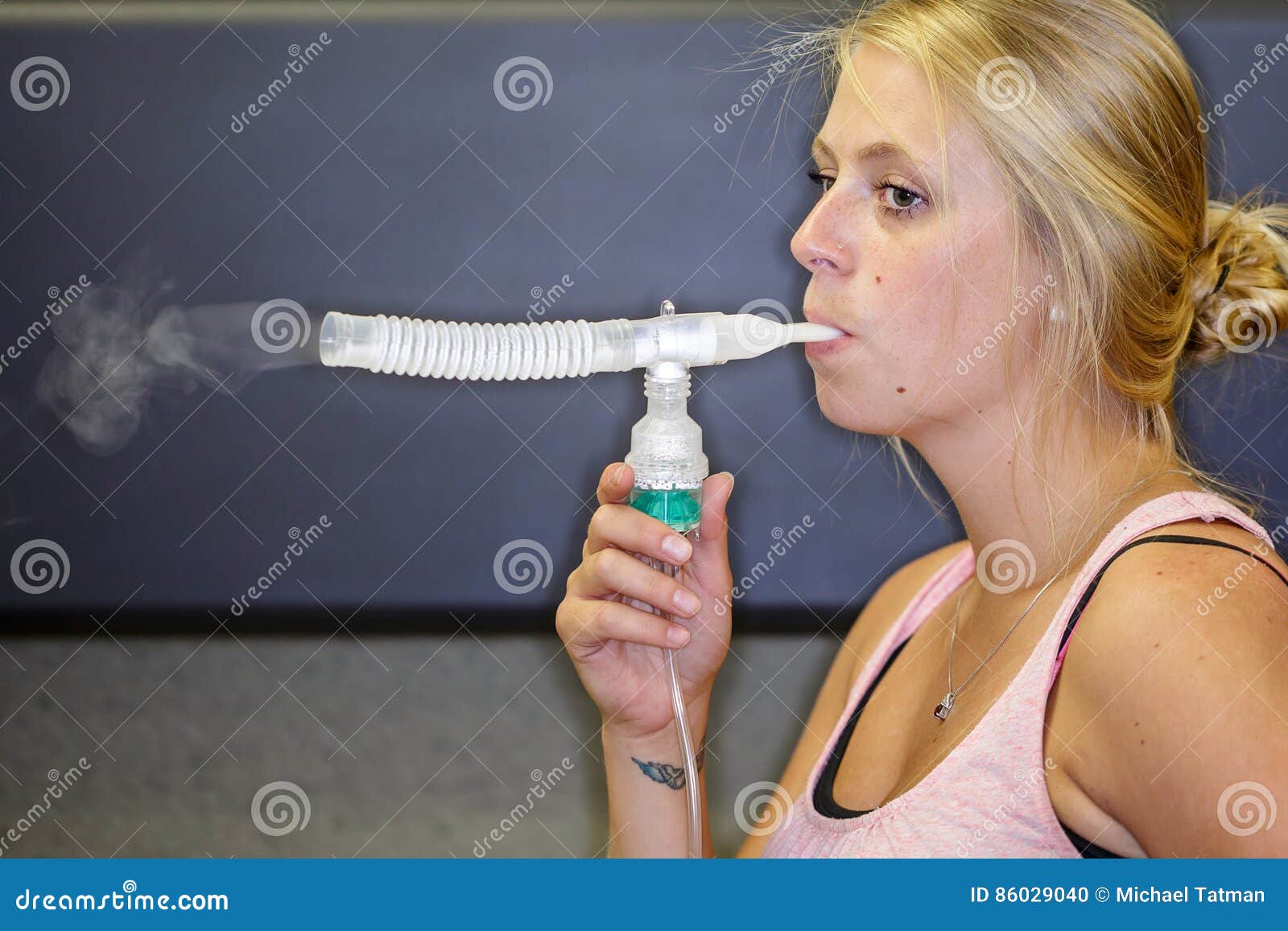 A Close Up of a Young Woman Using a Nebulizer Kit. Stock Photo - Image ...