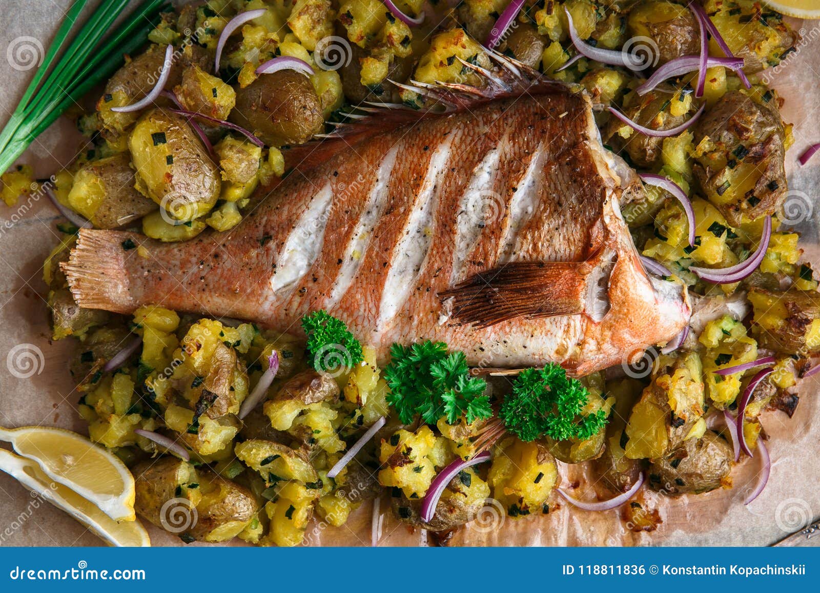 Close View of Red Grouper Baked with Potatoes, Top View Stock Photo ...
