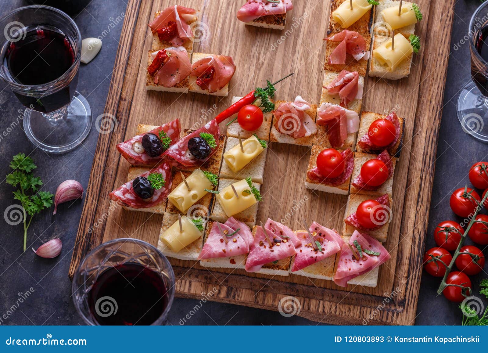Close View of Tiny Spanish Tapas with Jamon, Sausage, Cheese and Wine ...