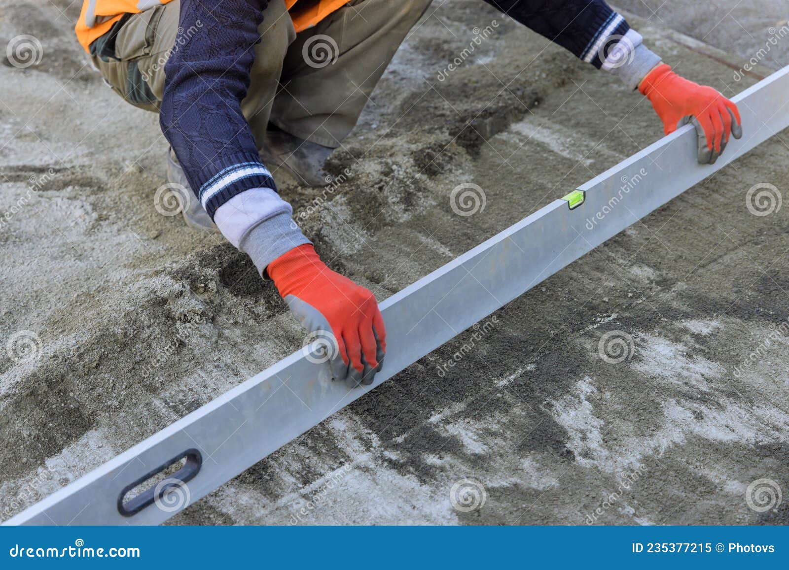 Close View of a Working Man Holding a Level Tool in Leveling ...