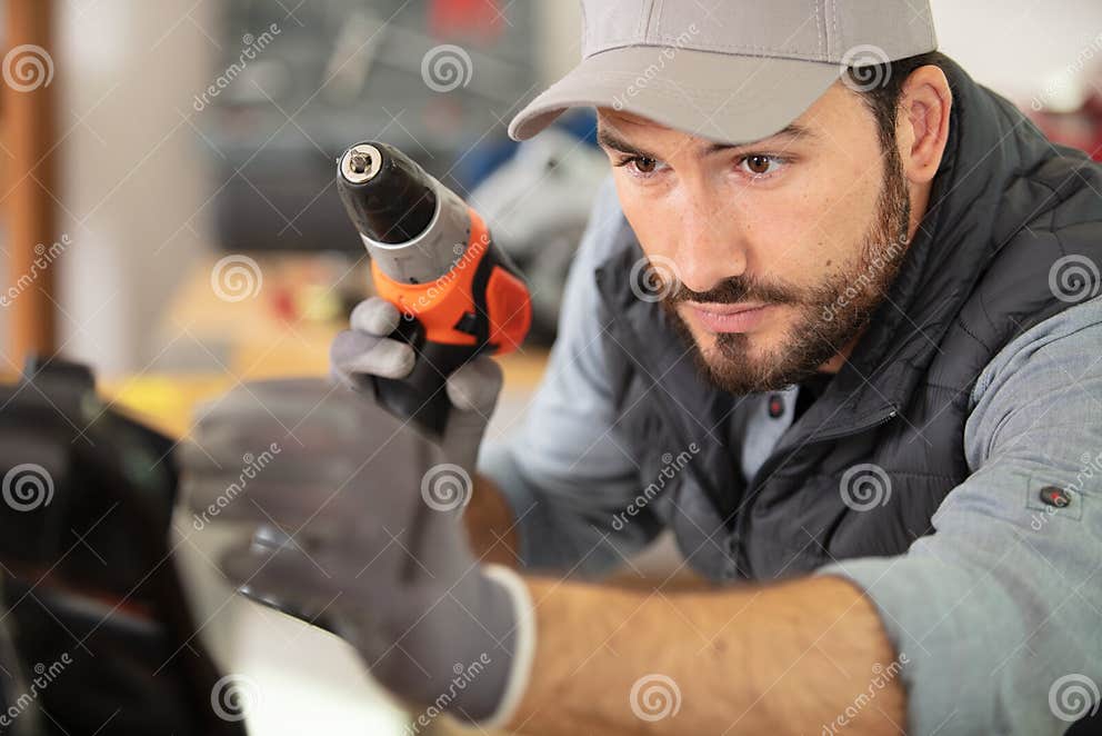 Close View Workman Using Cordless Screwdriver Stock Photo - Image of ...