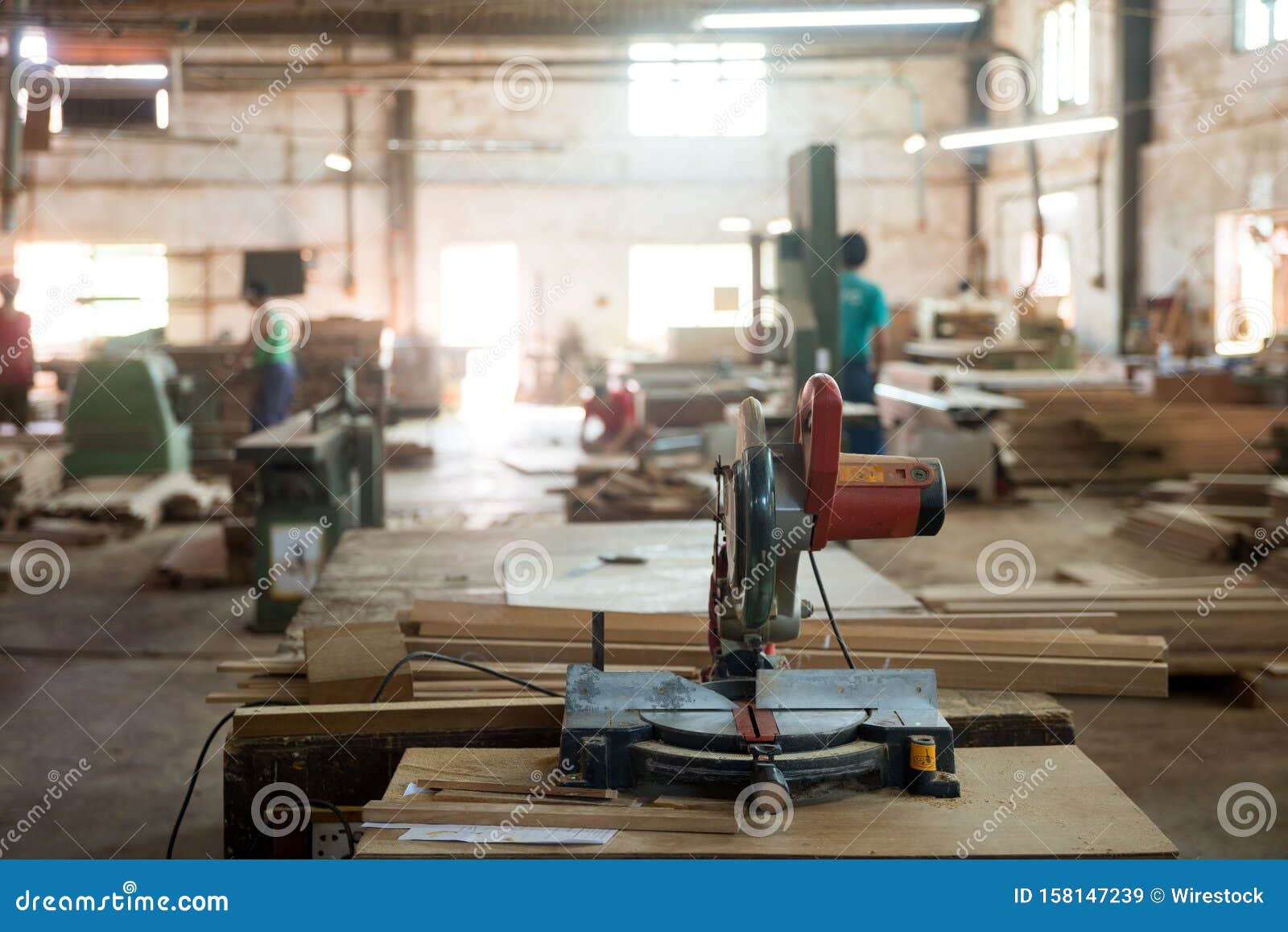 Close of a Wood Cutting Machine in the Factory with a Blurred ...