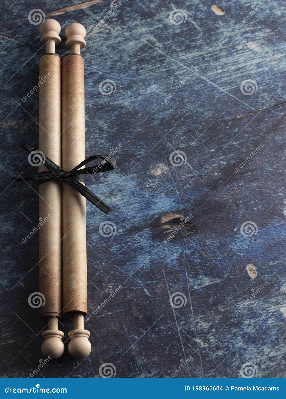 A Closed Antique Scroll on a Rustic Blue Wooden Table Stock Photo ...