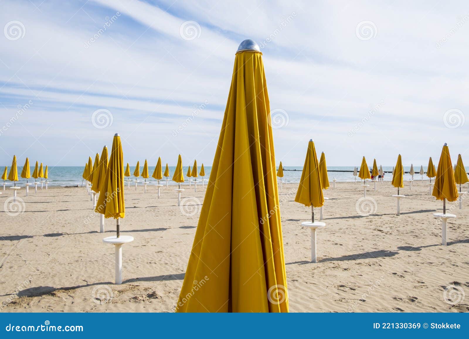 Closed Beach Umbrellas and Cloudy Sky Stock Image - Image of ocean ...
