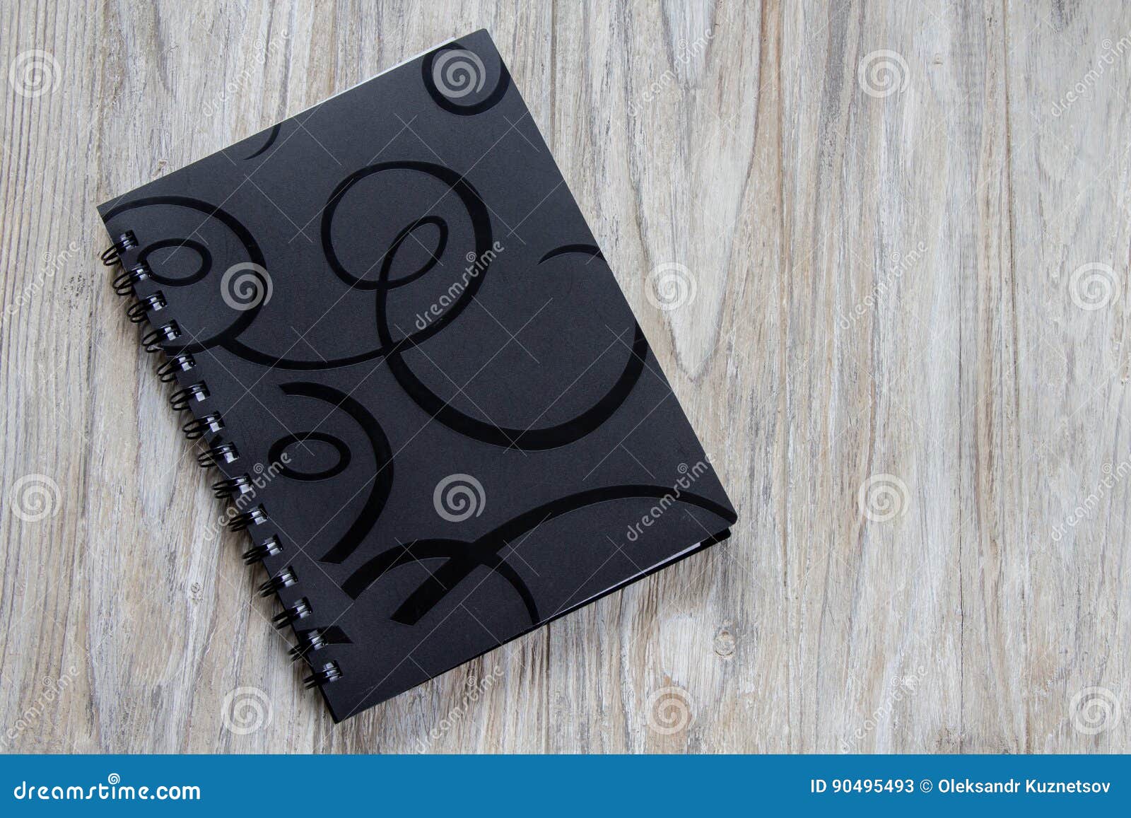 CLosed black notebook stock image. Image of curves, band - 90495493
