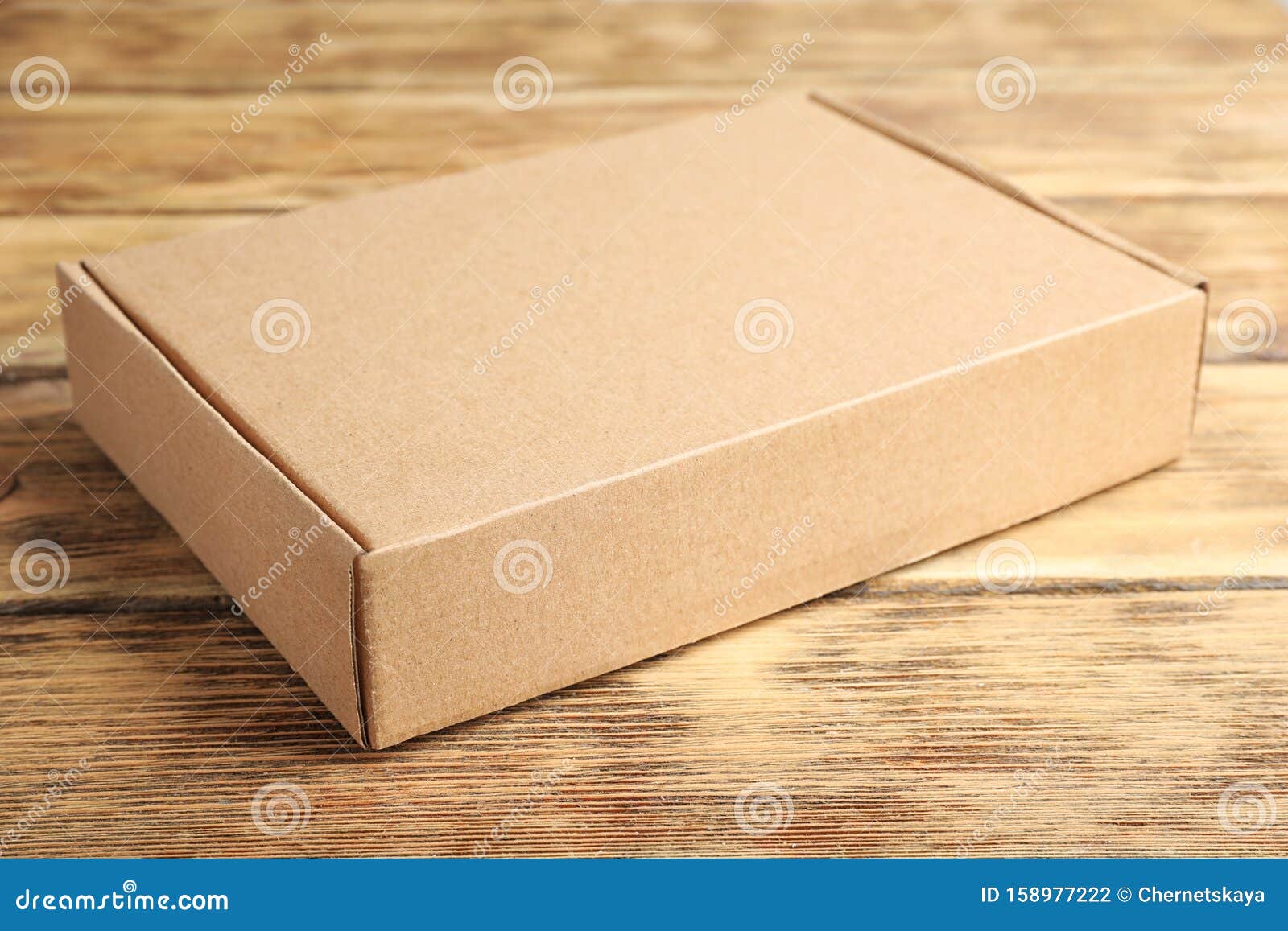 Closed Cardboard Box on Brown Table Stock Photo - Image of brown ...