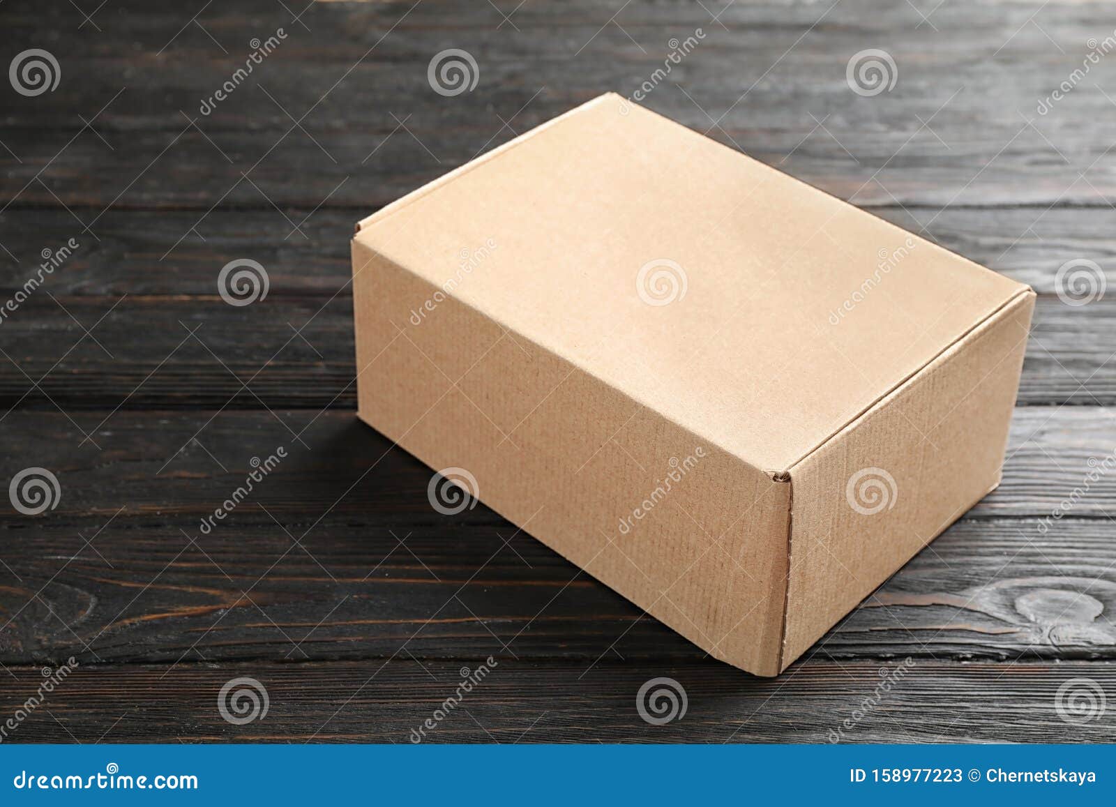 Closed Cardboard Box on Dark Table Stock Image - Image of cardboard ...