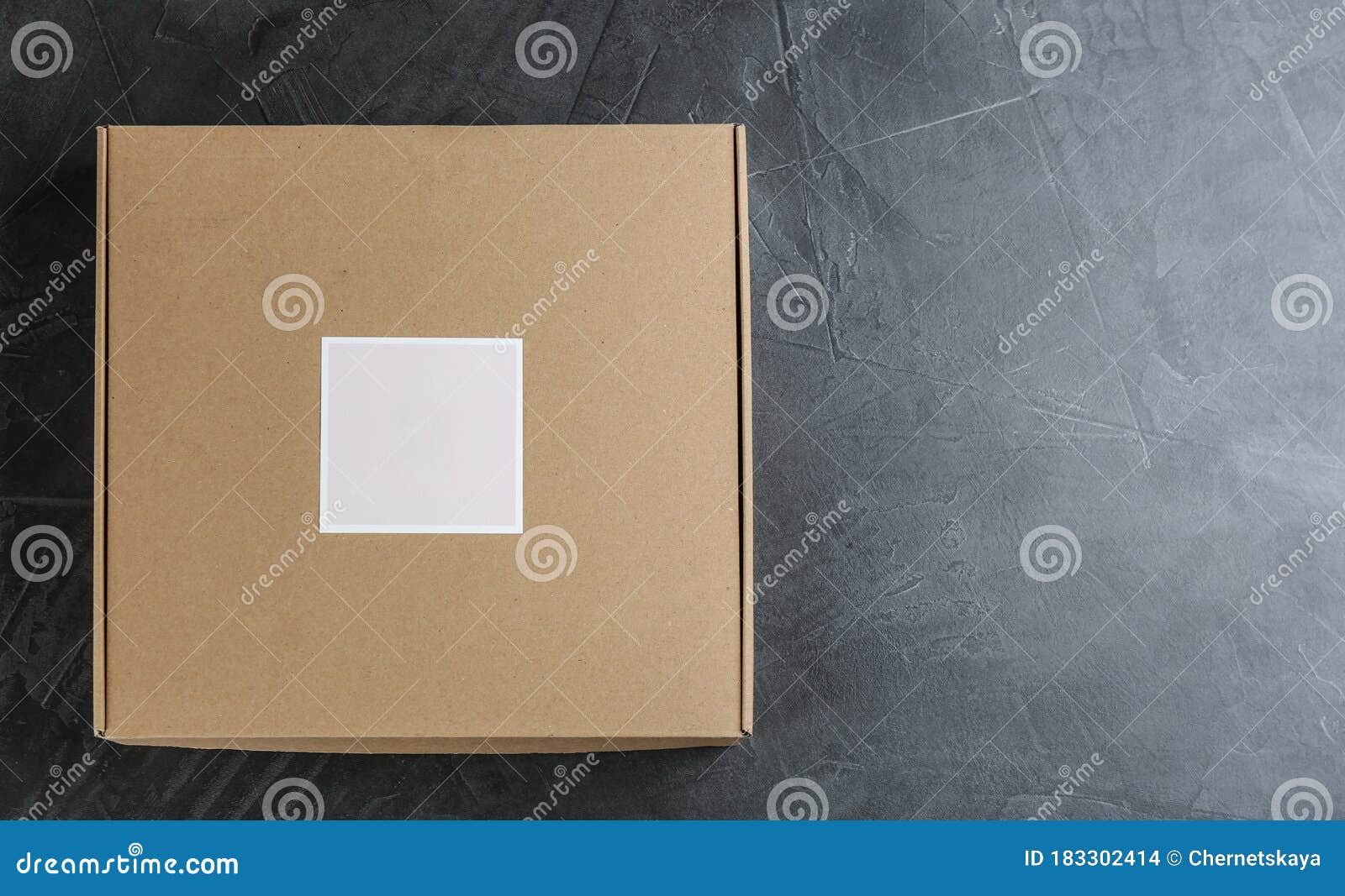 Closed Cardboard Box on Stone Table, Top View. Space for Text Stock ...