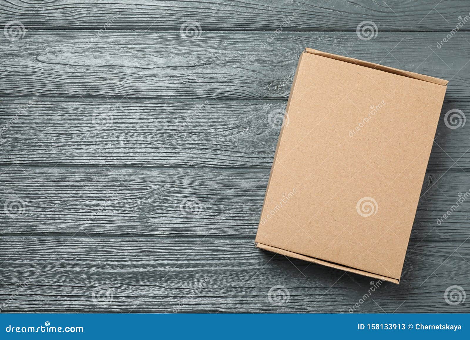Closed Cardboard Box on Grey Wooden Table, Top . Space for Text Stock ...