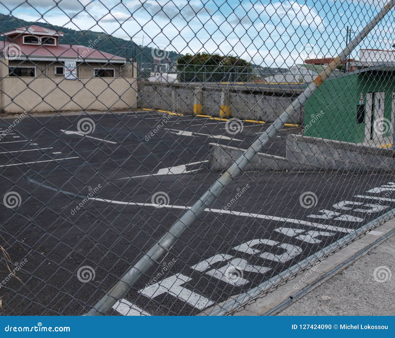A Closed and Empty Parking Lot Stock Photo - Image of steel, yellow ...