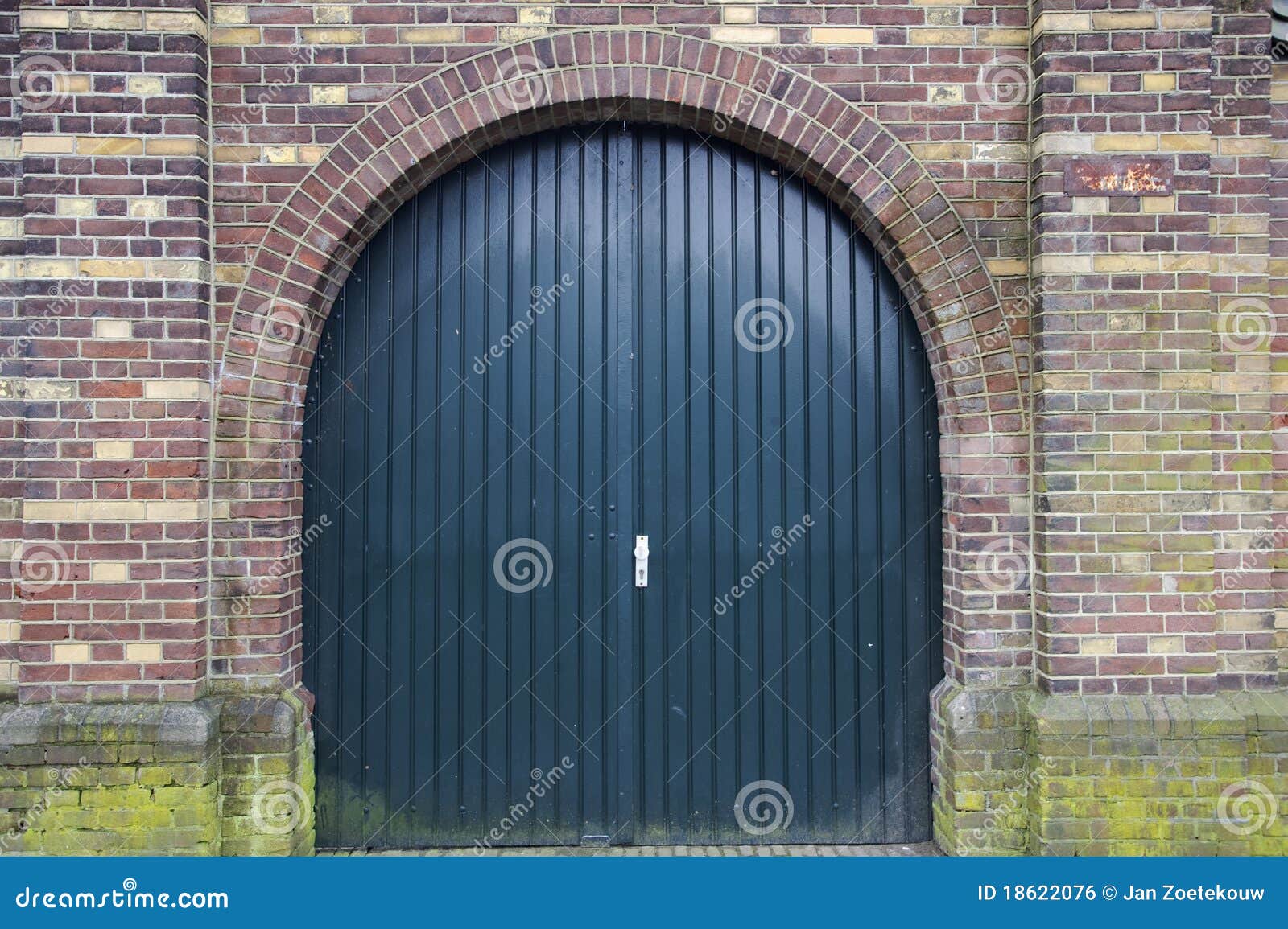 Closed gate in brick wall stock photo. Image of entrance - 18622076