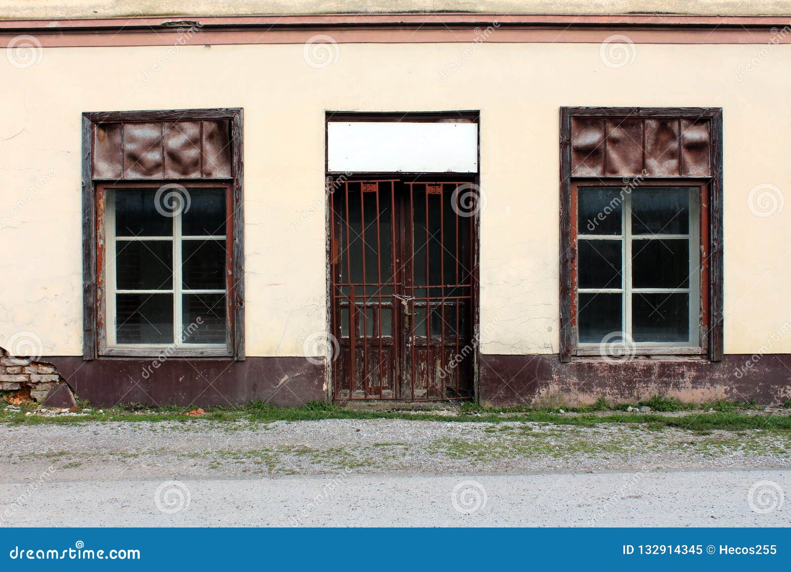 Closed Hardware Store Front with Two Windows and Locked Doors with ...