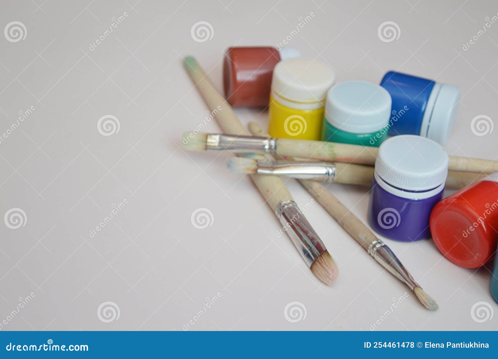 Closed Jars with Gouache of Different Colors and Bristle Brushes on a ...