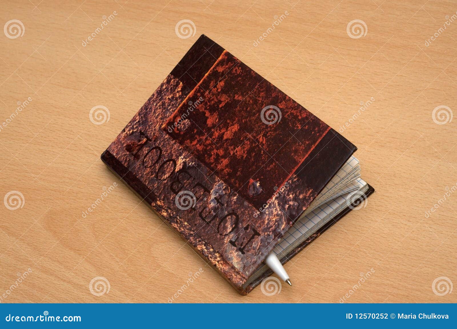 The Closed Notebook with the Pen Inside Stock Photo - Image of table ...