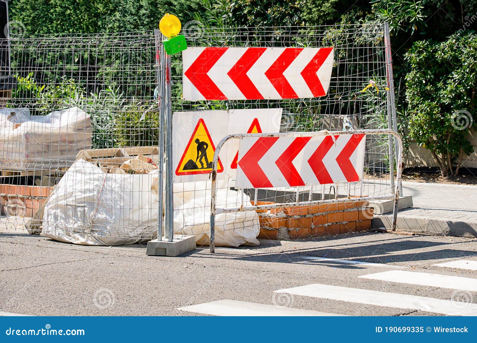 Closed-off Construction Site with Warning Signs in a Street Stock Image ...