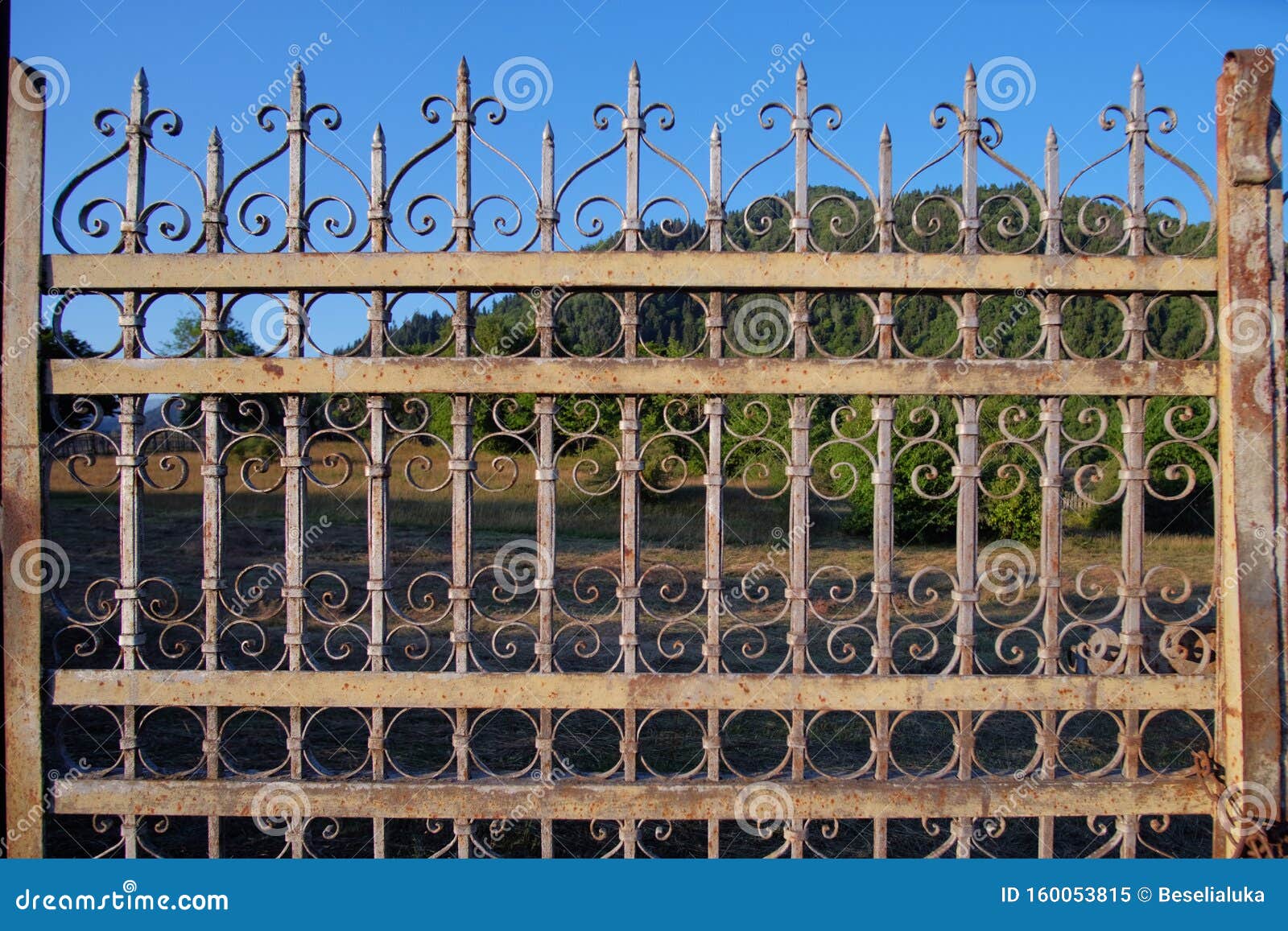 A closed rusty gate stock image. Image of door, spike - 160053815