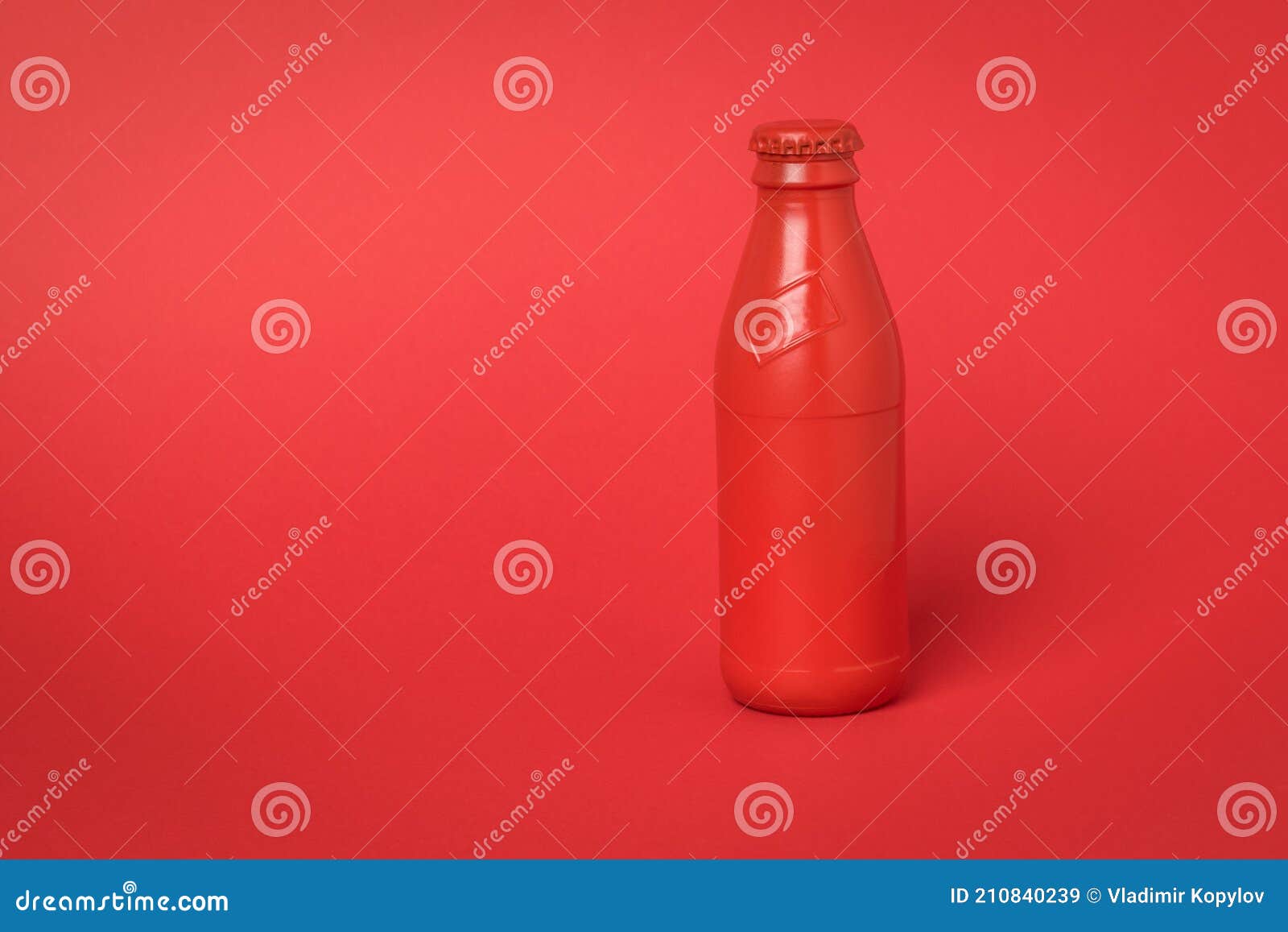 A Closed Red Bottle on a Bright Red Background Stock Image - Image of ...