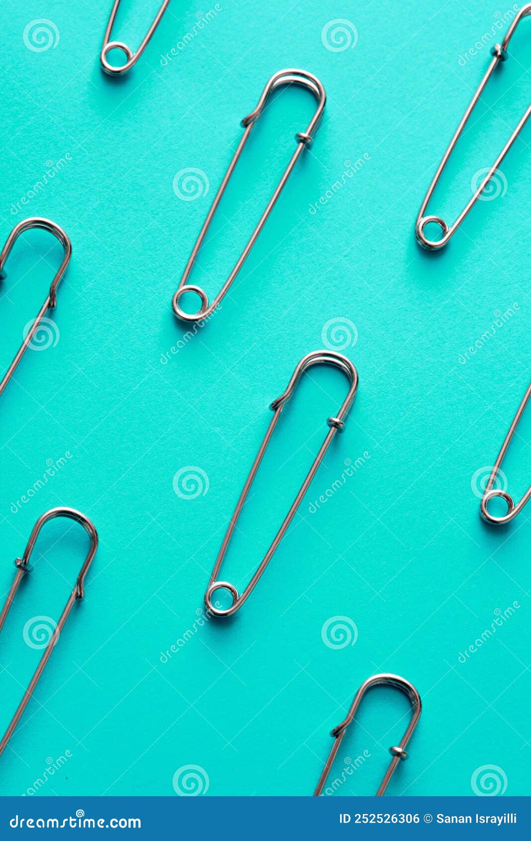 Closed Safety Pins on Cyan Background Stock Photo - Image of safety ...