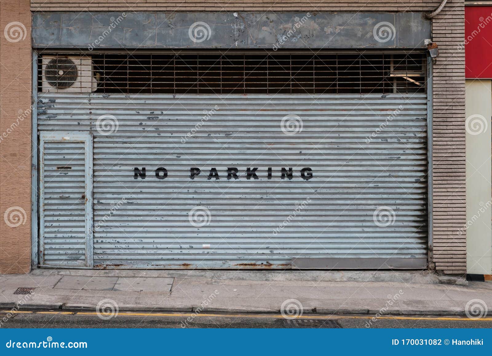 Closed Shutter on Store or Shop Front Saying No Parking Stock Photo ...