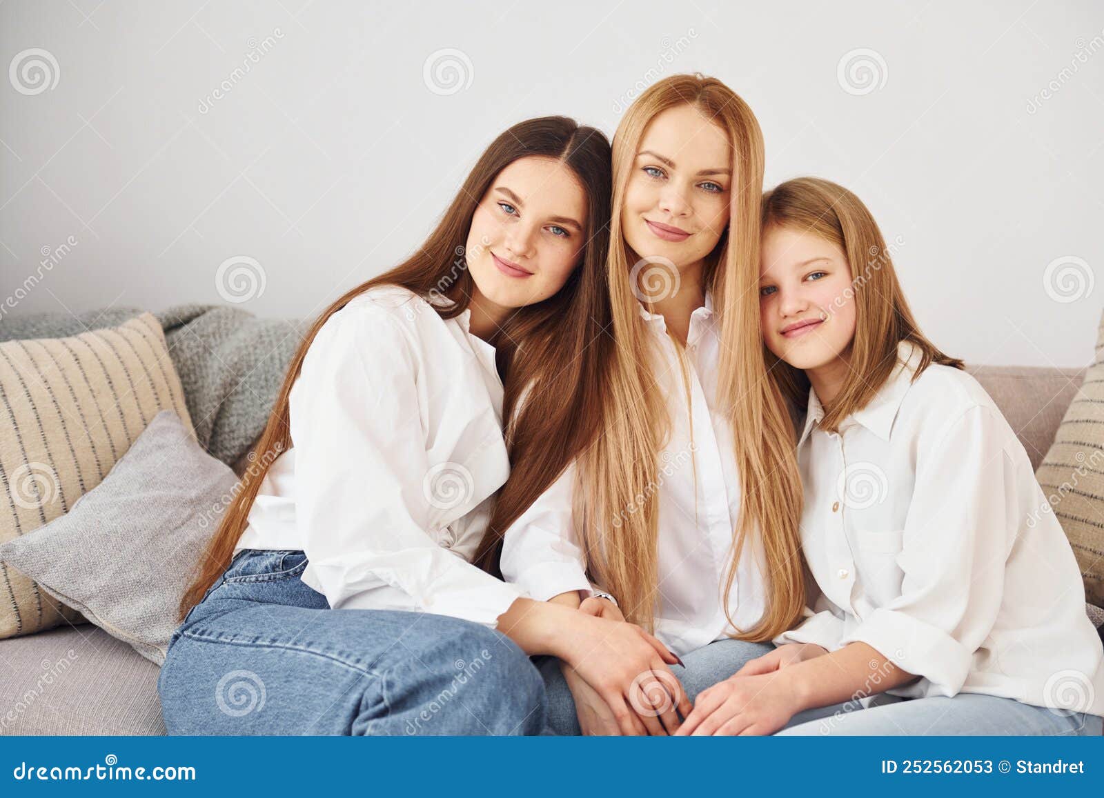 Closeness Of The People Young Mother With Her Two Daughters At Home At