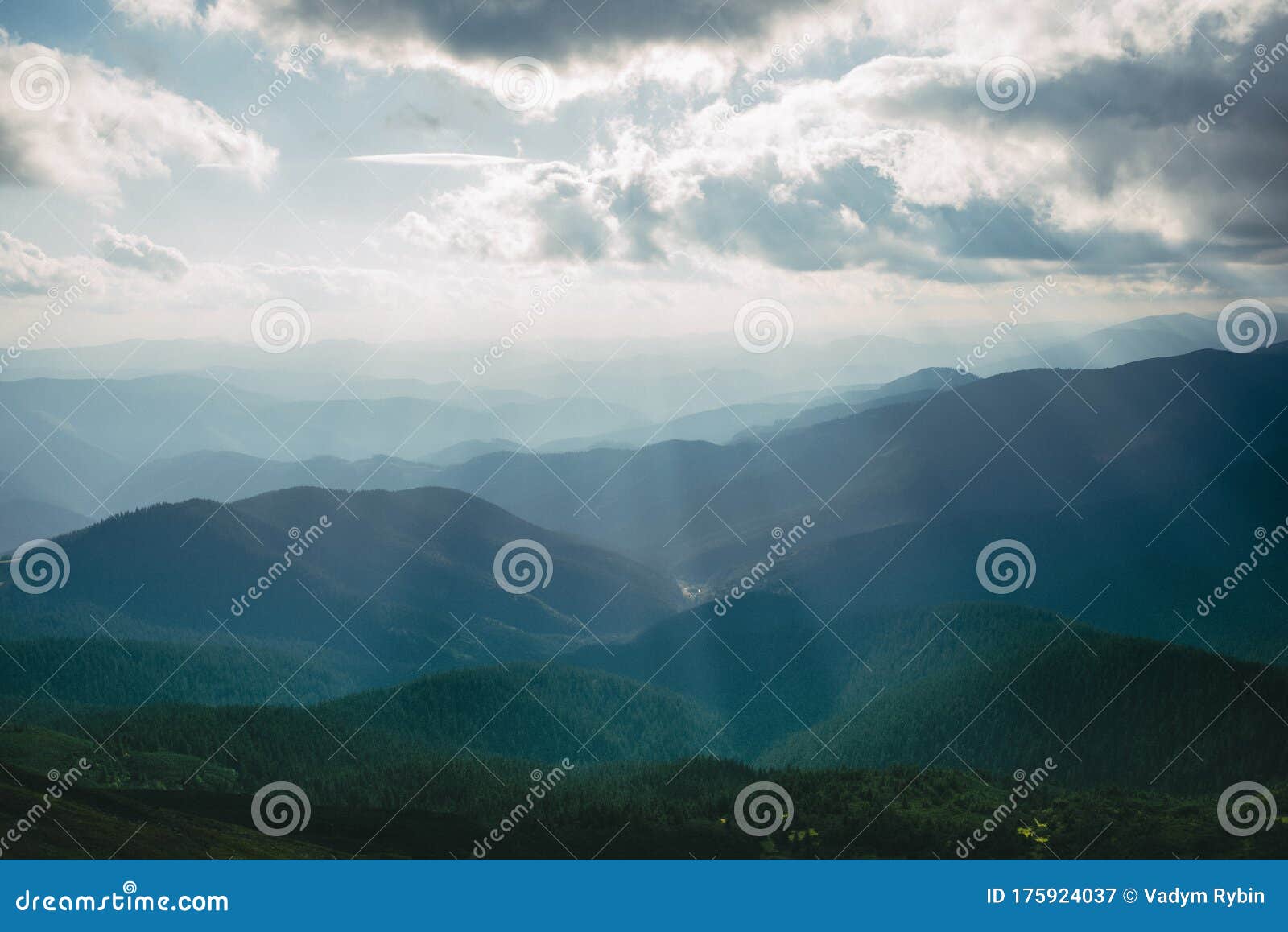 Rays of Sun Beaming through Clouds in the Carpathian Mountains Stock ...