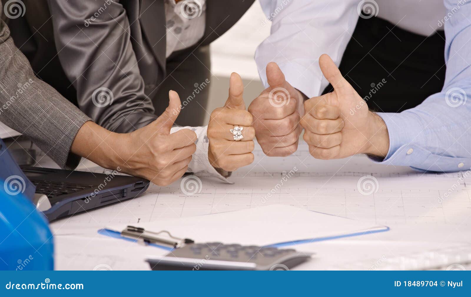 Closeup of 4 Thumbs Up in Office Stock Photo - Image of coworkers ...