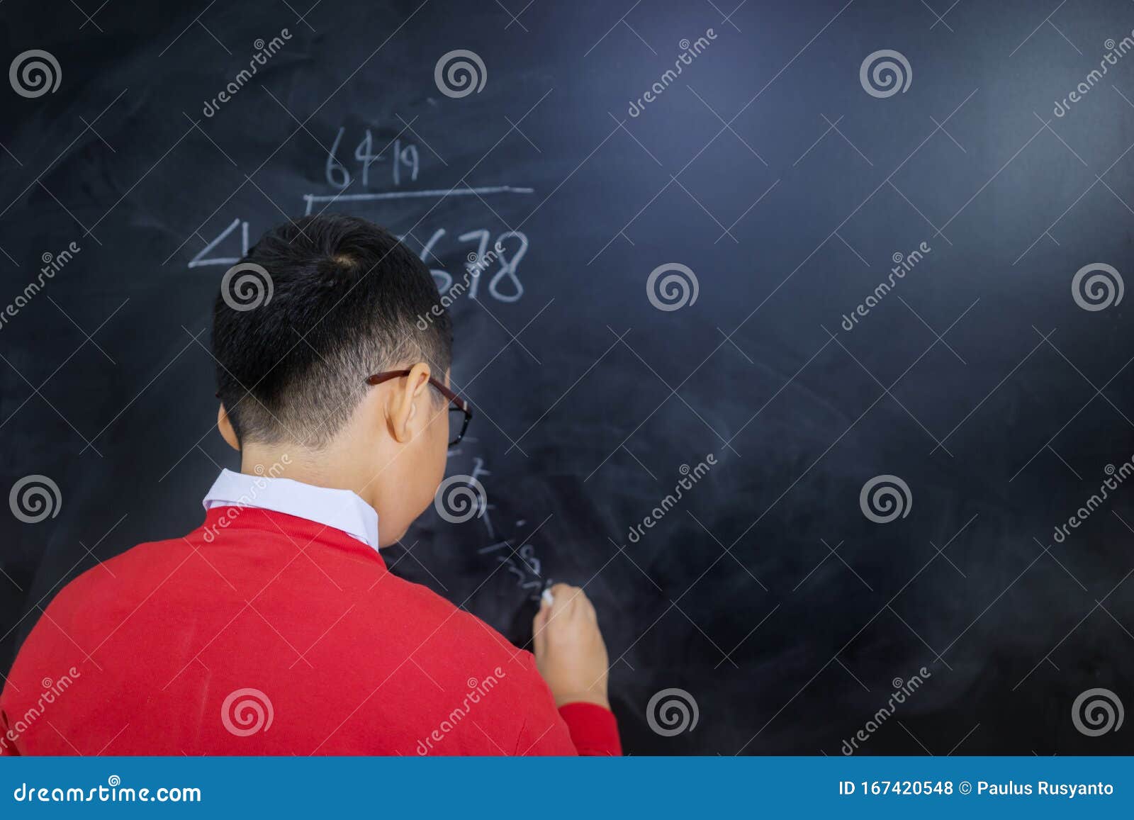 Closeup of an Adorable Boy Solving Calculations Stock Photo - Image of ...