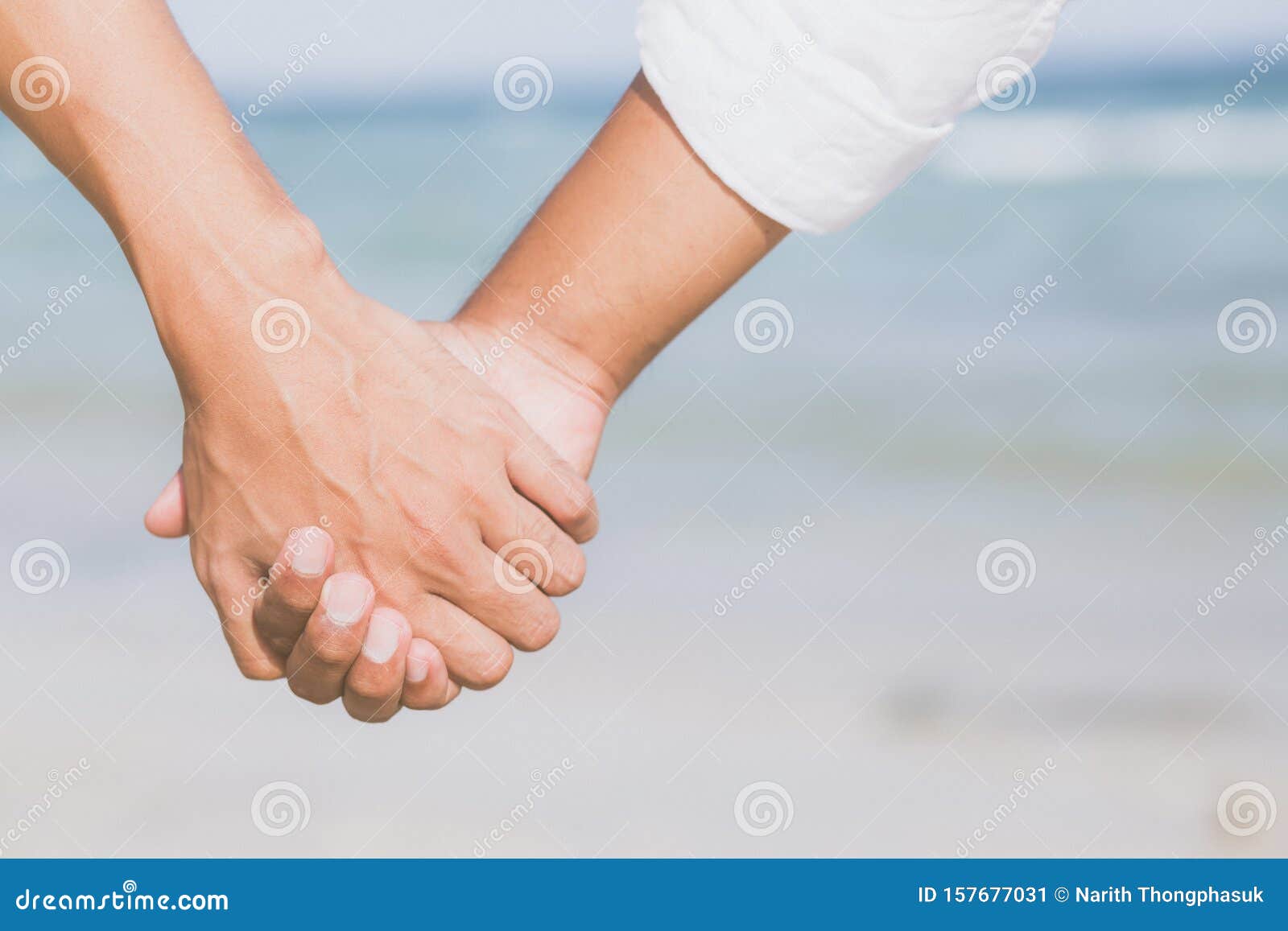 Closeup Asian Gay Couple Holding Hands Together On The Beach With Relax