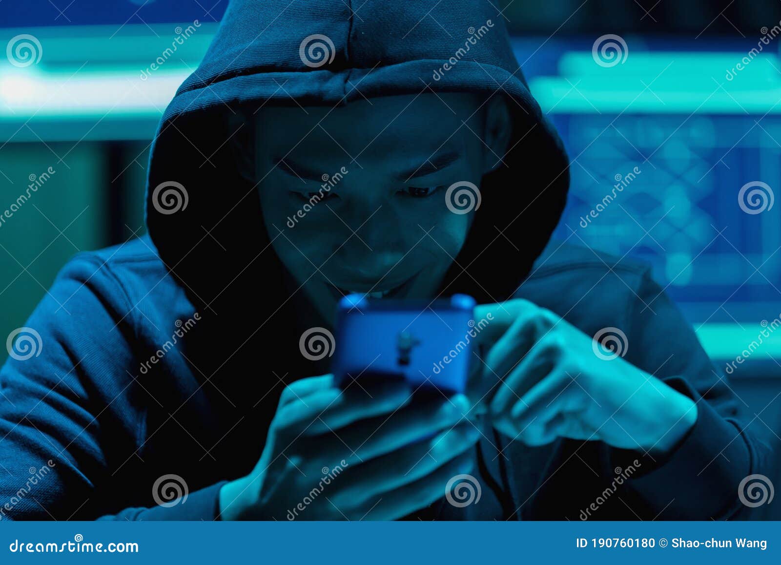 Male Hacker In A Robber Mask Uses Phone, Credit Card And Laptop In Some ...