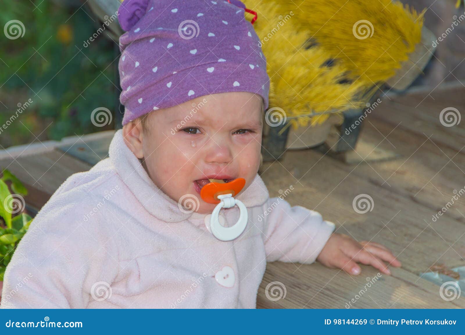 Closeup of a Baby Crying with a Pacifier in His Mouth. Stock Image ...