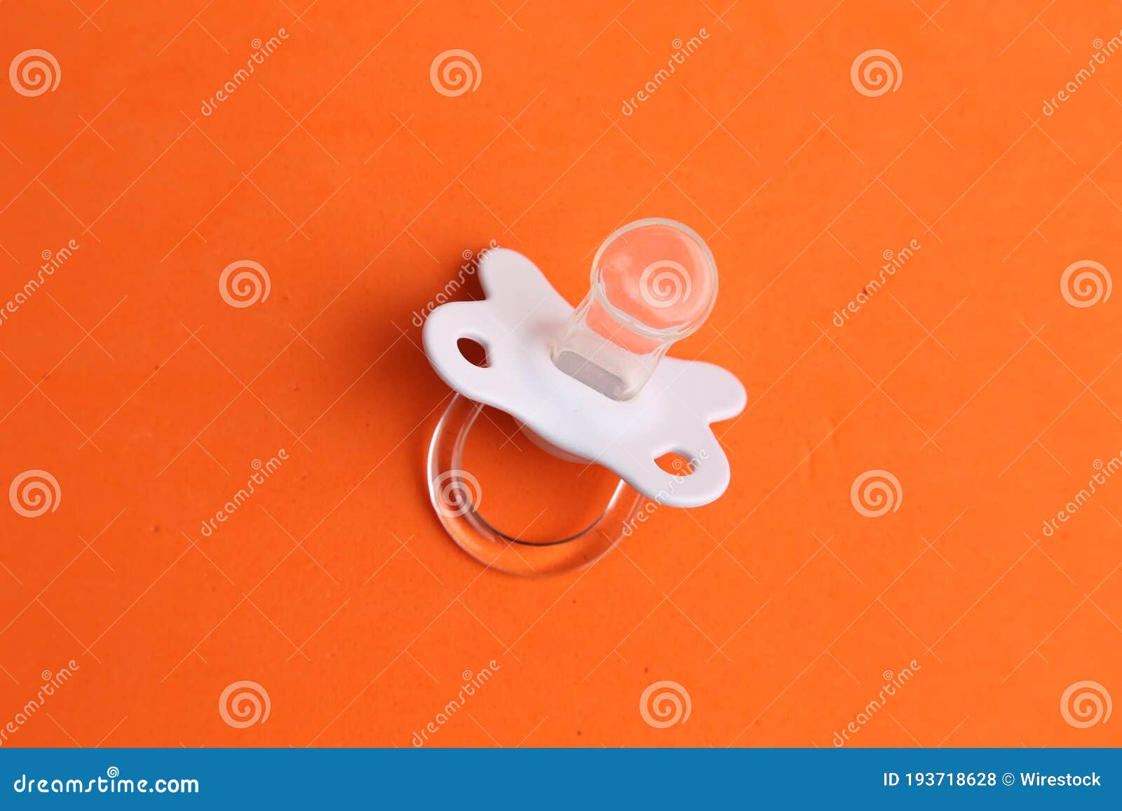 Closeup of a Baby Pacifier on an Orange Background Stock Photo - Image ...