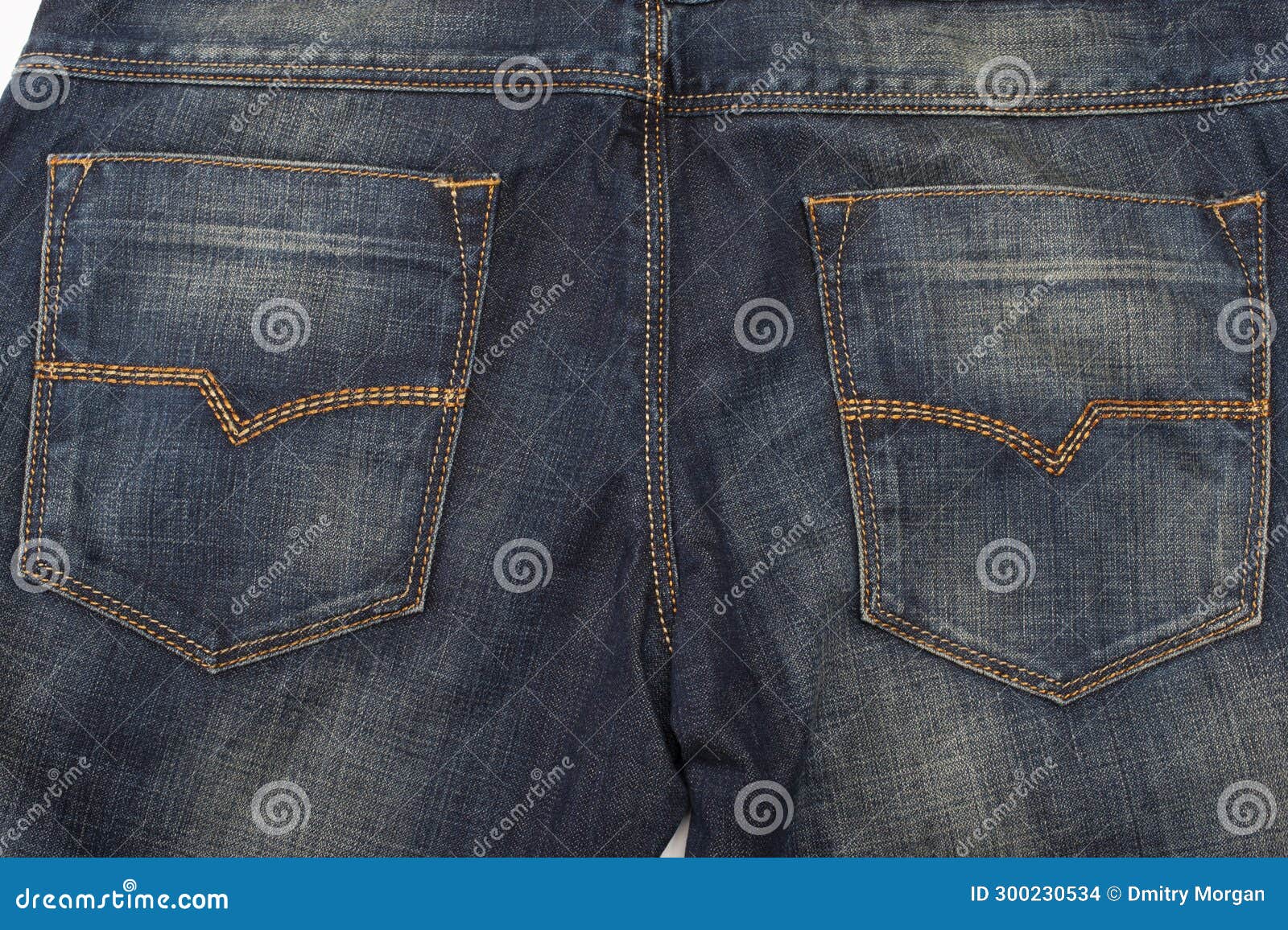 Closeup of Back Side of Pair of Dark Blue Washed Mens Jeans on Pure ...