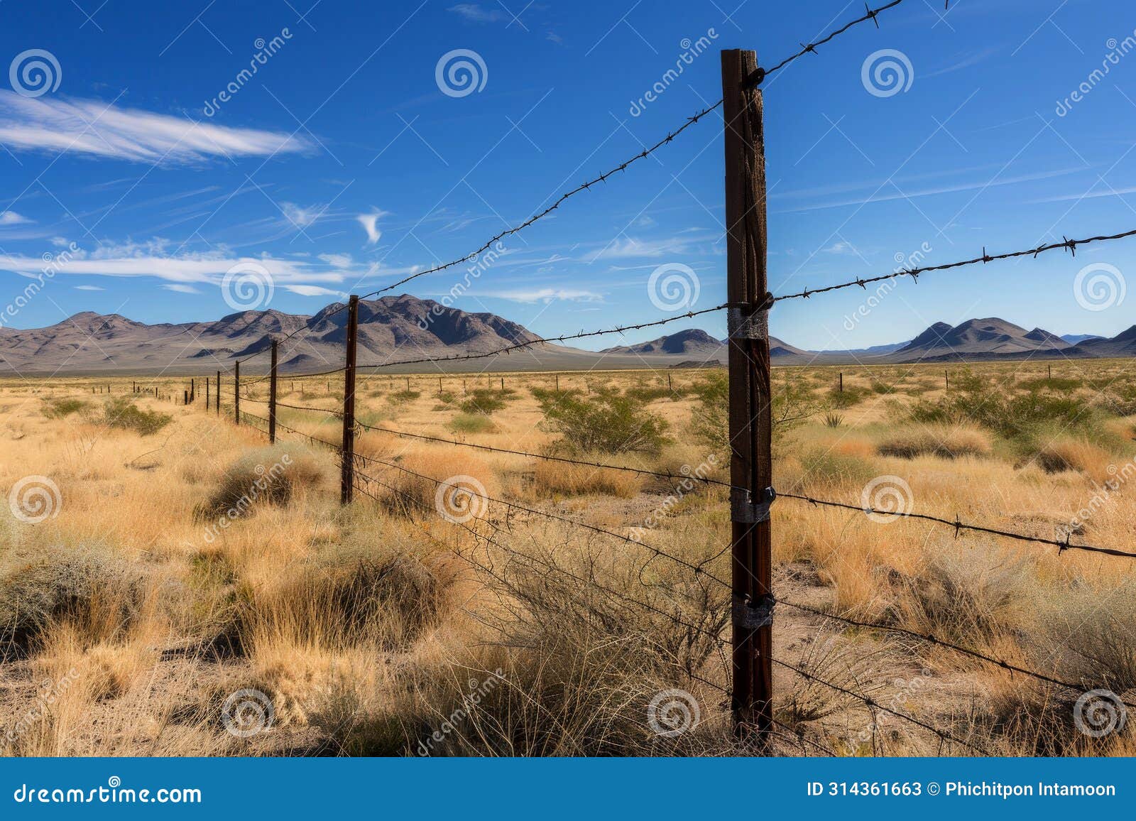 A Closeup of the Barbed Wire on Top of an Outdoor Fence Symbolizing ...
