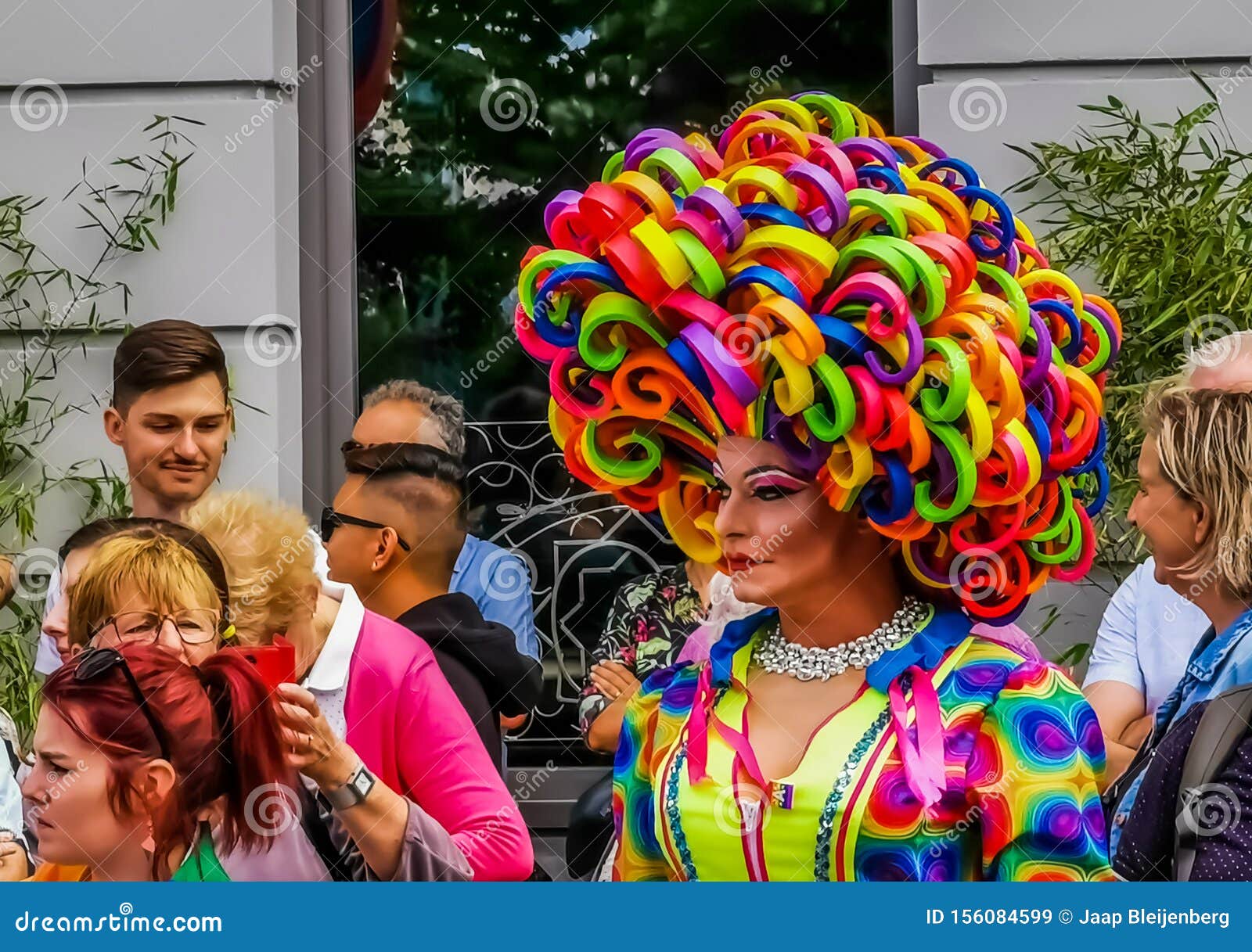 Closeup Of A Beautiful Drag Queen In A Colorful Dress And Rainbow Wig