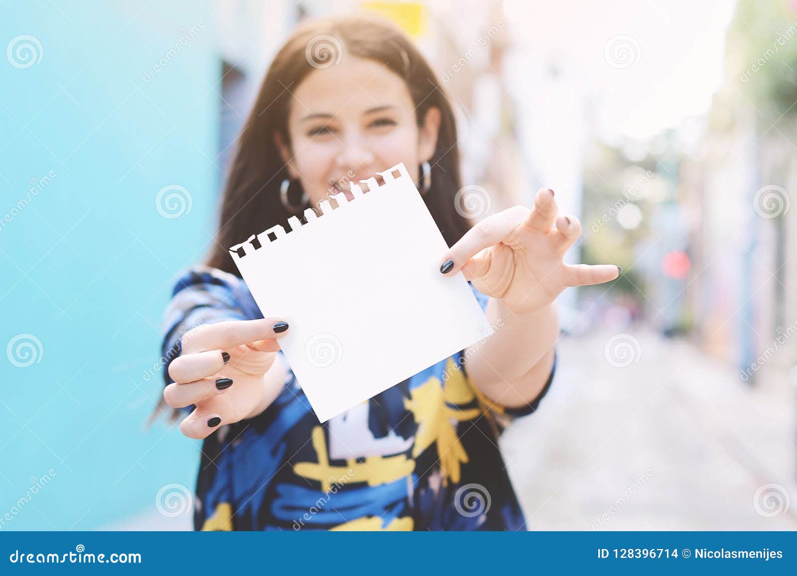Closeup of a Beautiful Woman Showing a Blank Notepad. Stock Photo ...
