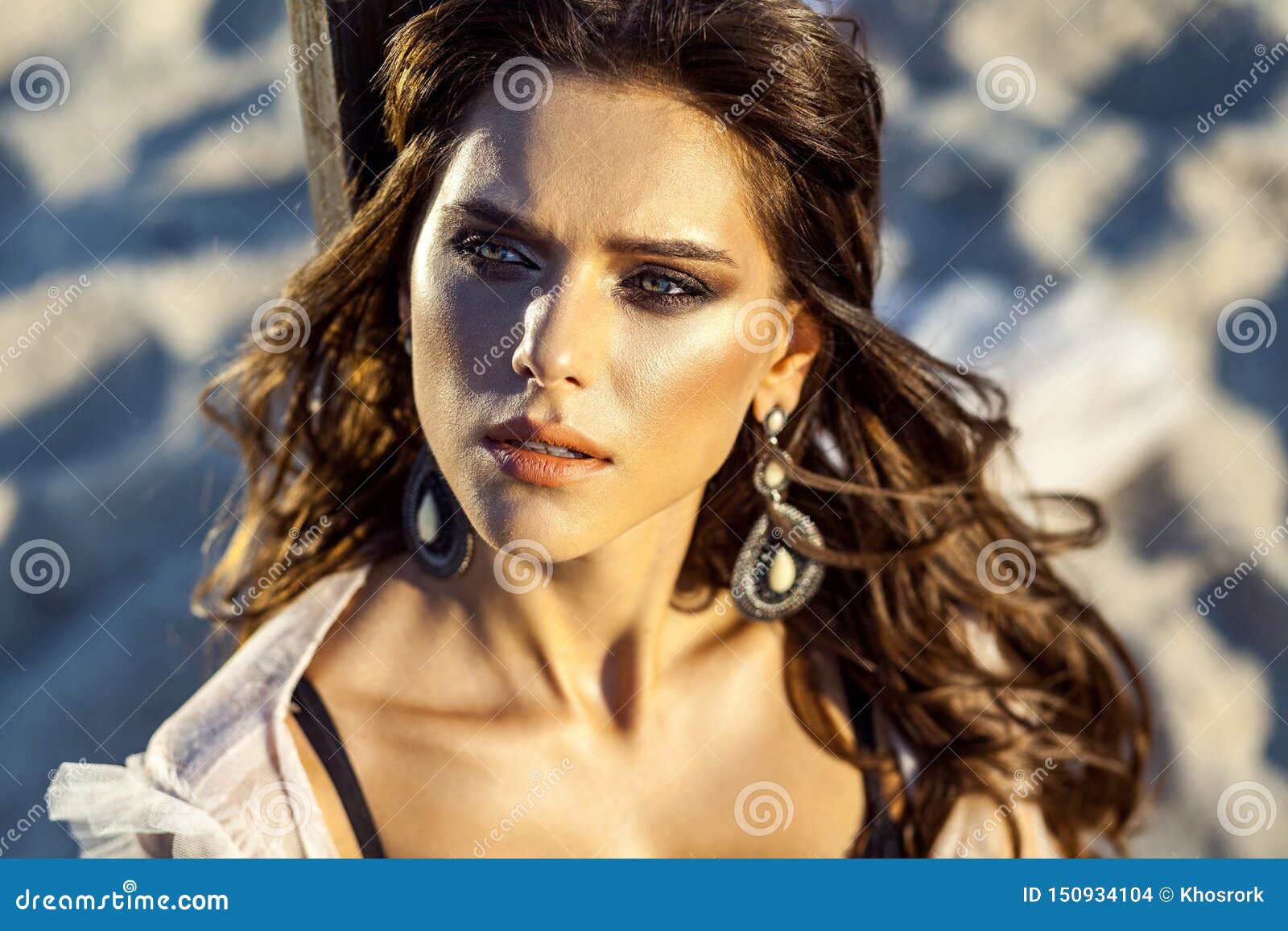 Closeup Beauty Portrait Of Attractive Brunette Woman Posing On Sandy