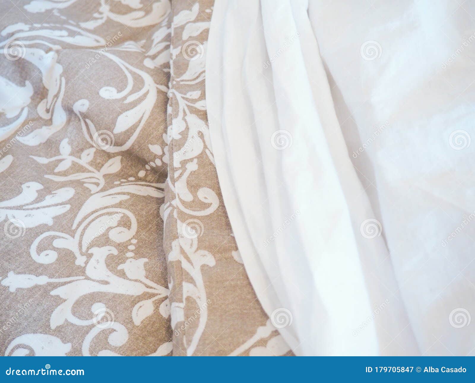 Closeup of a Bed with Beige Sheets in Bright Bedroom Interior Stock ...