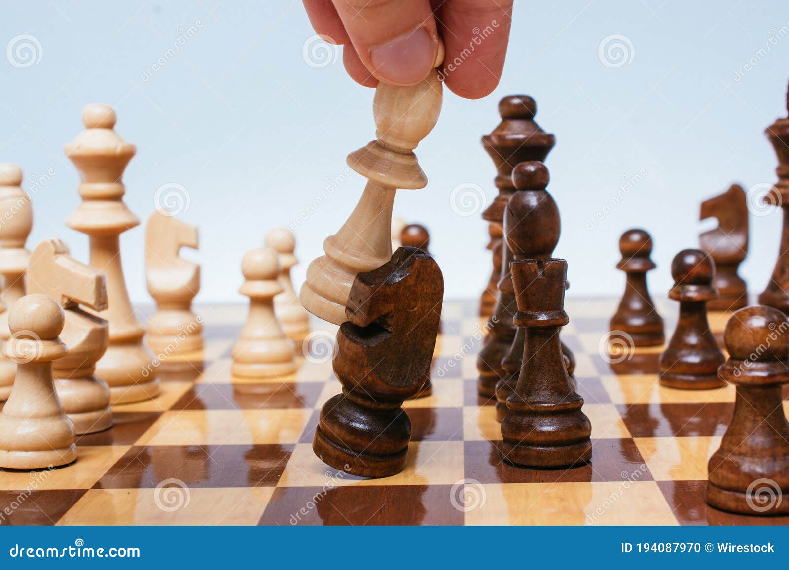 Closeup of a Bishop Chess Piece Knocking Down the Knight on a ...