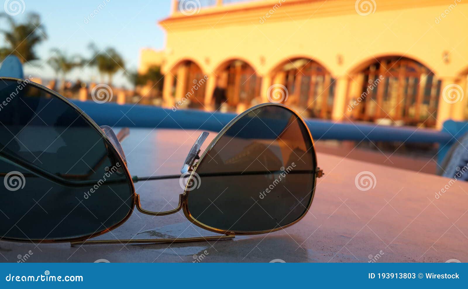 Closeup of Black Sunglasses on the Table Outdoors Stock Image - Image ...