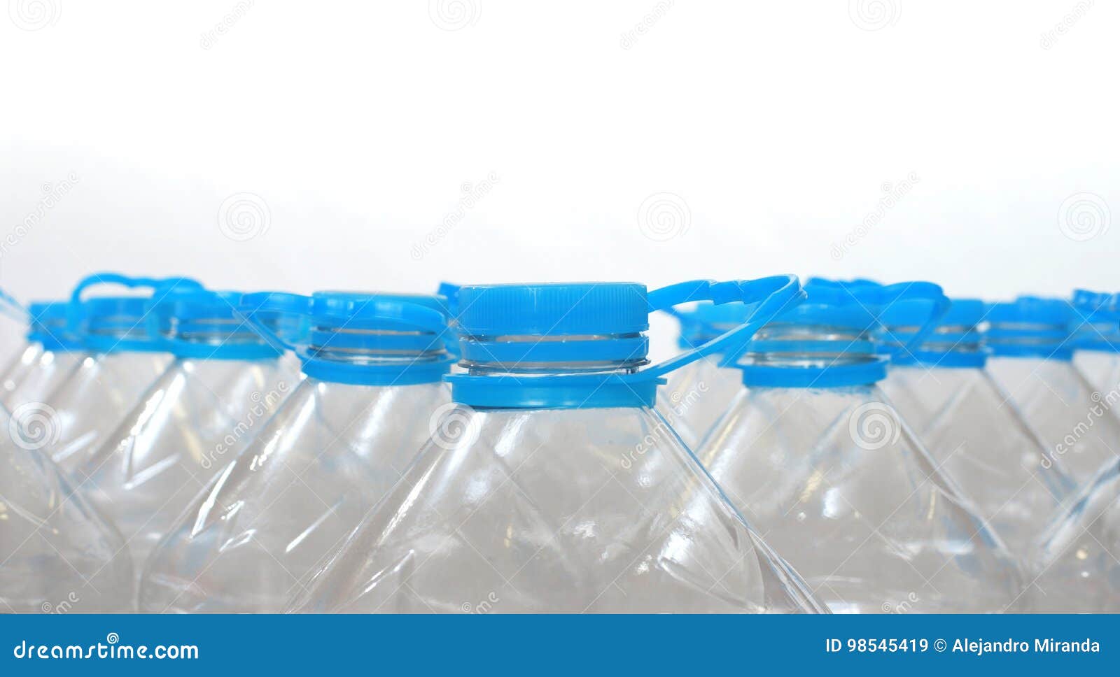 Closeup of Blue Cap of a Group of Transparent Plastic Empty Bottles ...