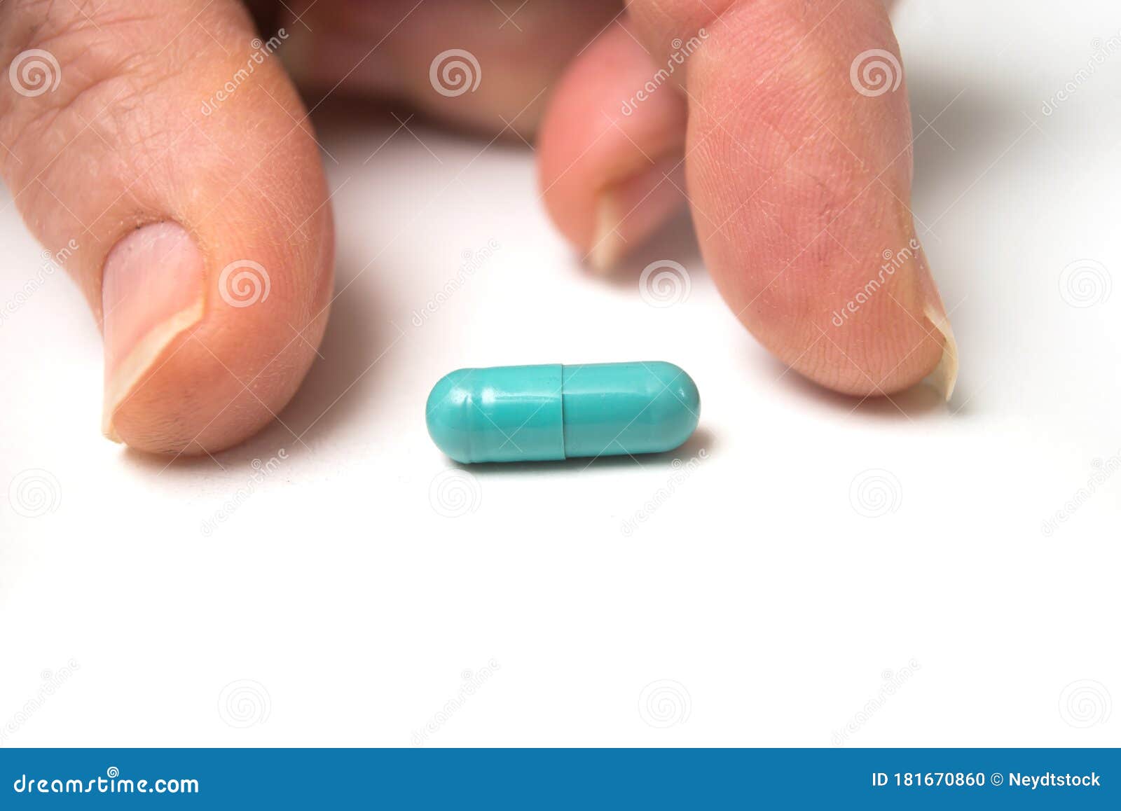 Blue Capsule in Hand on White Background Stock Photo - Image of closeup ...