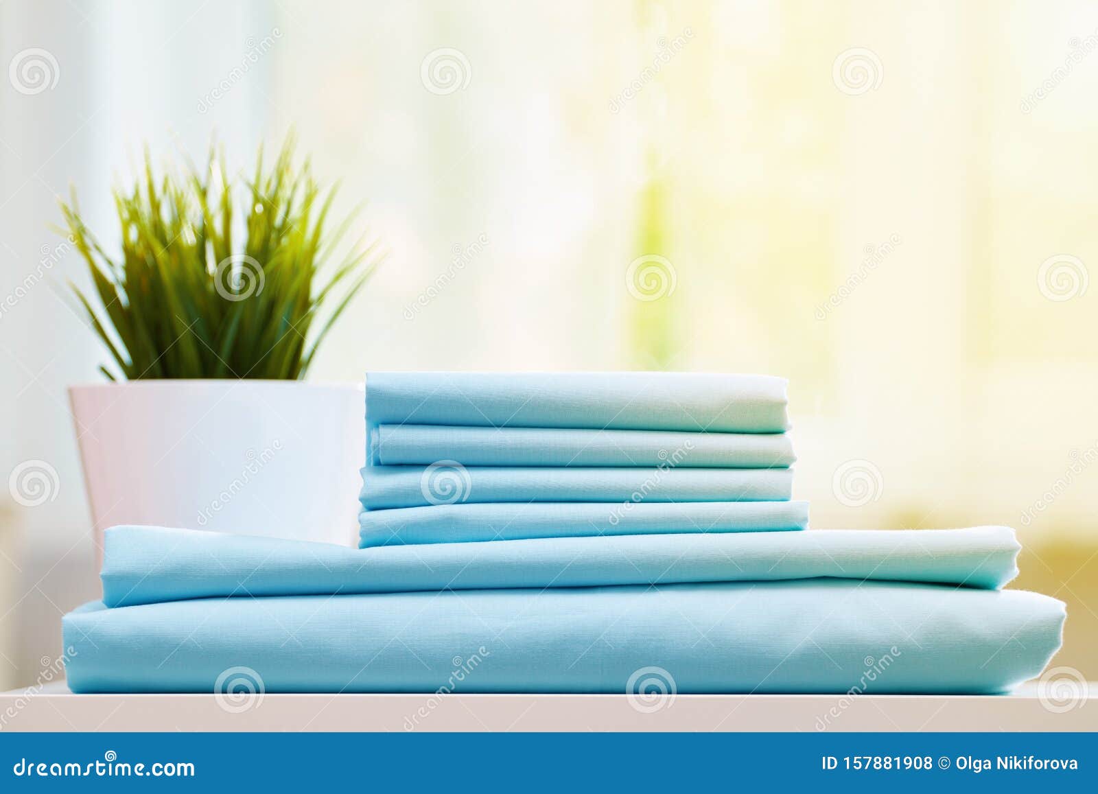 Closeup of Blue Clean Bedding on a Blurred Background. a Stack of ...