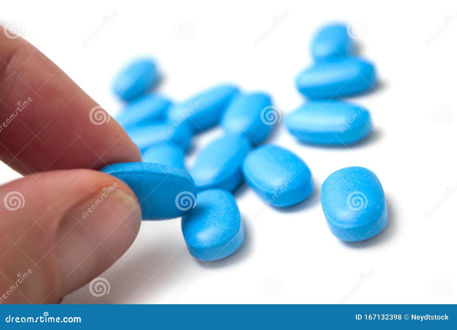 Blue Pils in Hand on White Background Stock Photo - Image of magnesium ...