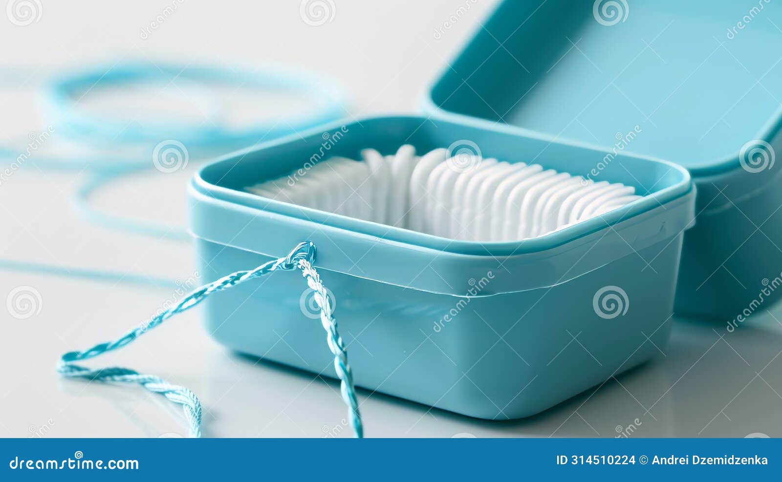 Closeup of Blue Plastic Packaging with Dental Floss on White Background ...