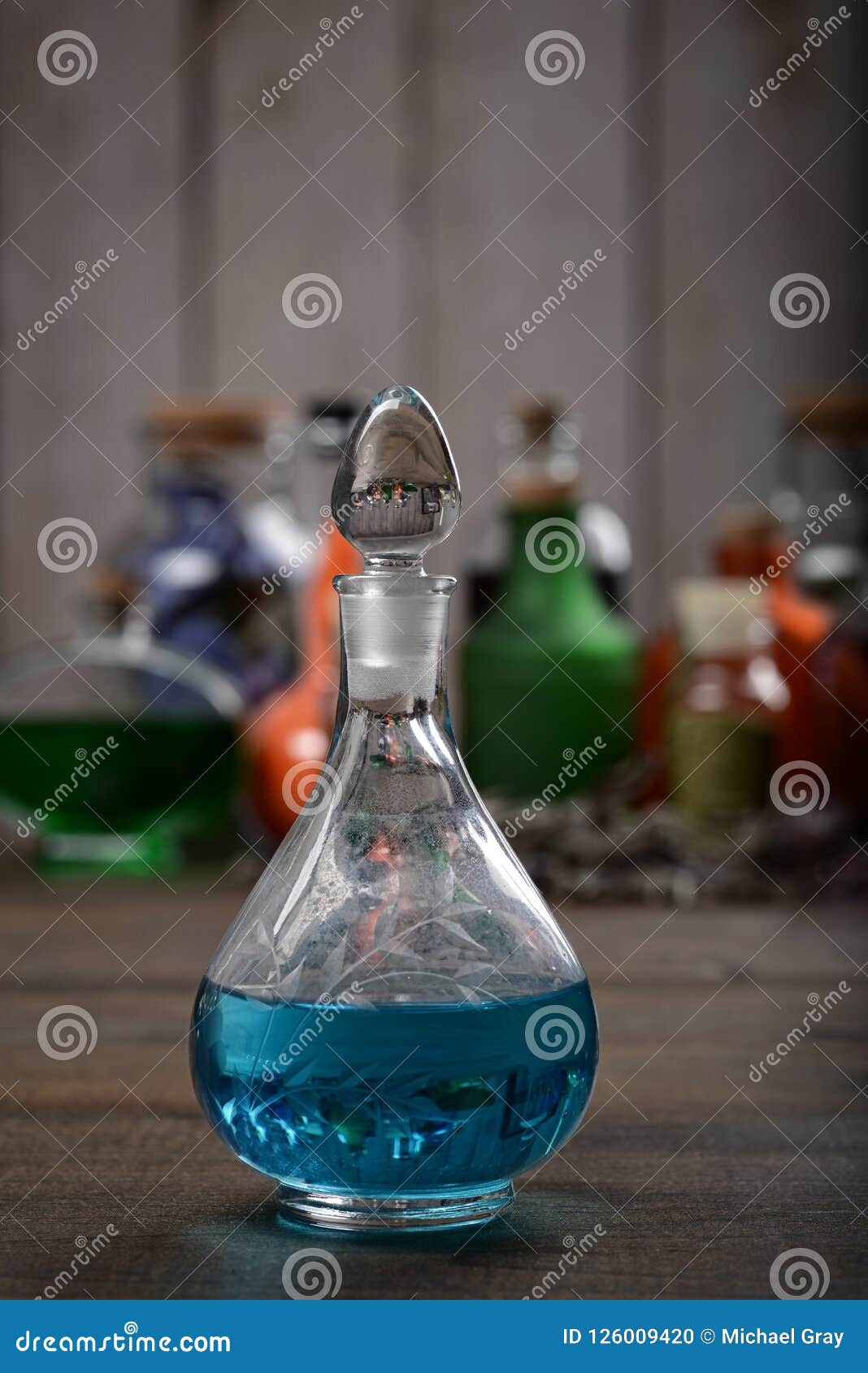 Closeup Blue Potion in Glass Bottle Stock Photo - Image of fall, black ...