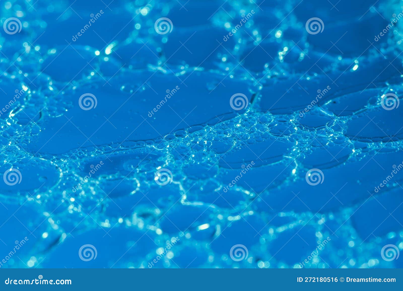 Closeup of Blue Translucent Soap Bubbles Floating on the Water Surface ...