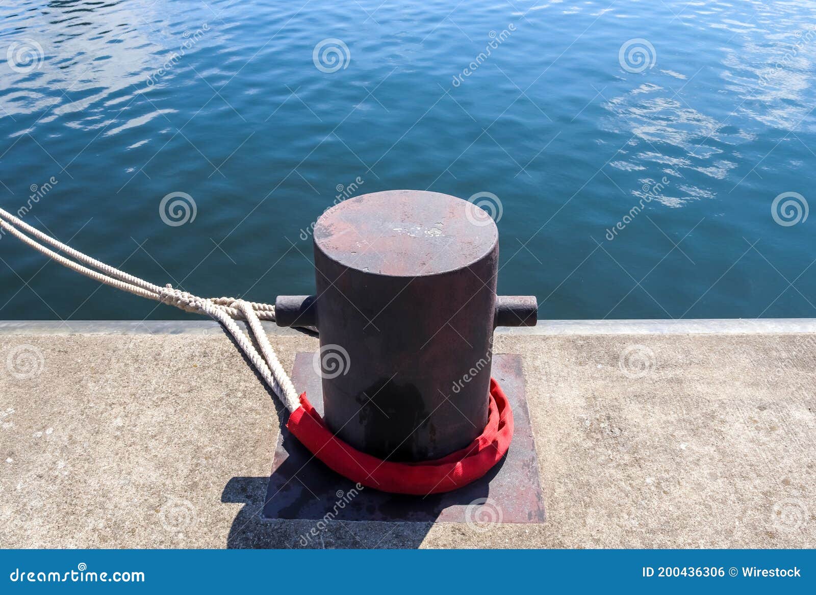 Closeup of a Boat Bollard on a Dock Stock Photo - Image of rigging ...